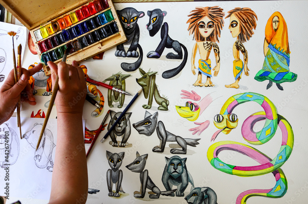 The animator draws with a pencil and draws characters from cartoons ...