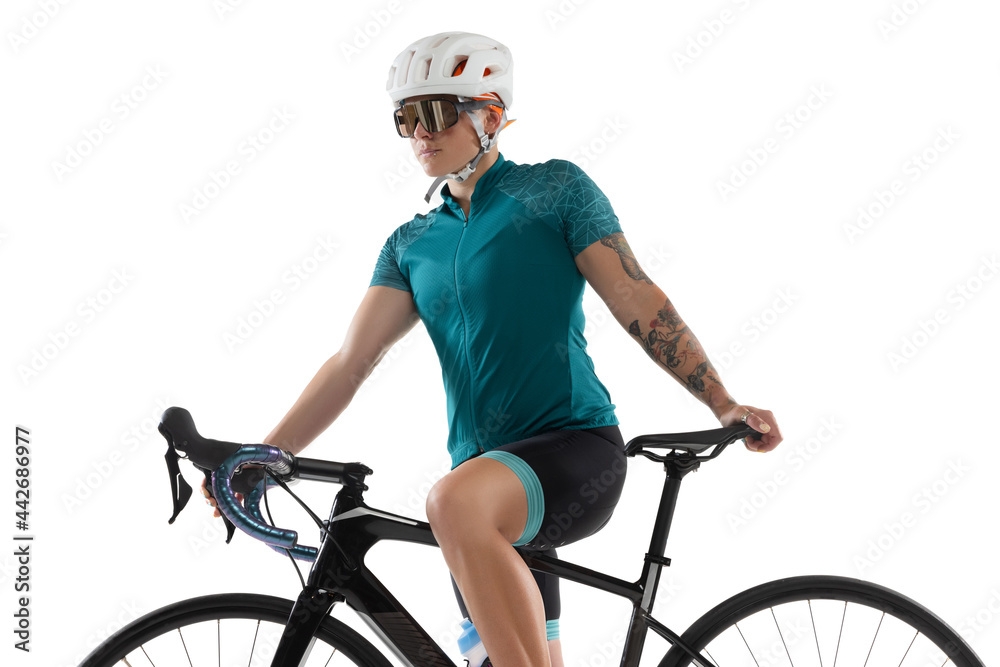 Young professional female bike rider on road bike isolated over white ...