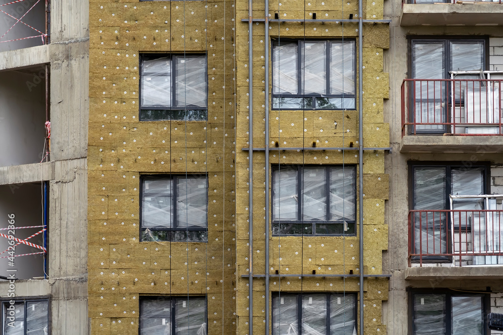 Installation of external wall thermal insulation with rock wool ...