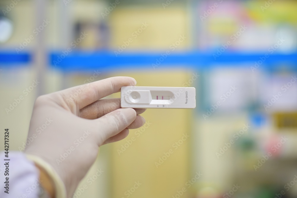 Strip test Covid-19 antigen positive. Stock Photo | Adobe Stock