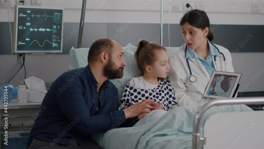 Cardiologist woman doctor discussing heart cardiogram explaining ...