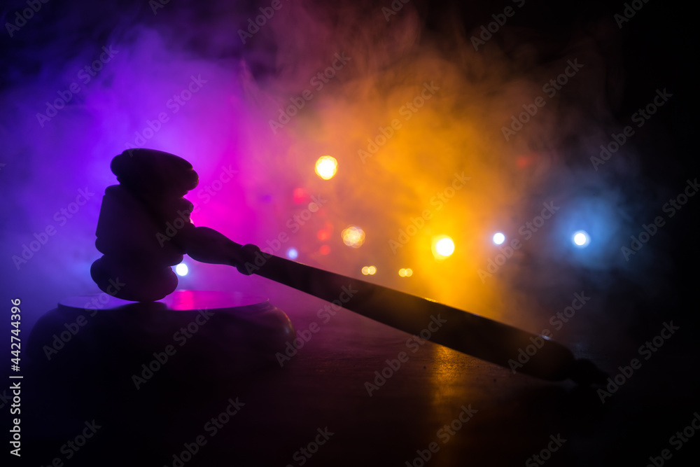 Law theme, mallet of the judge on wooden desk . Silhouette of police ...