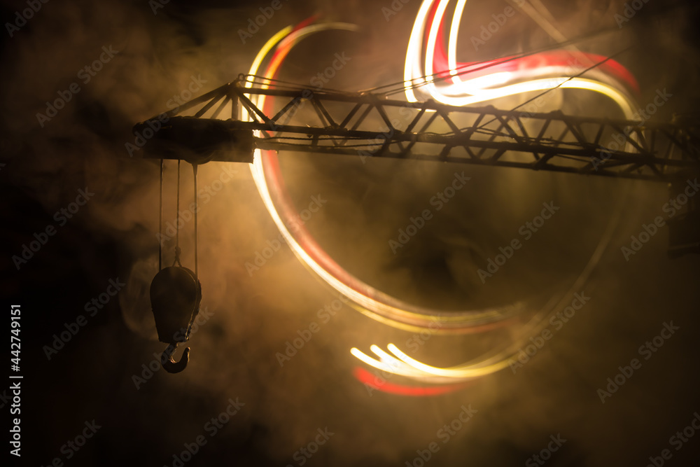 Abstract Industrial background with construction crane silhouette over ...