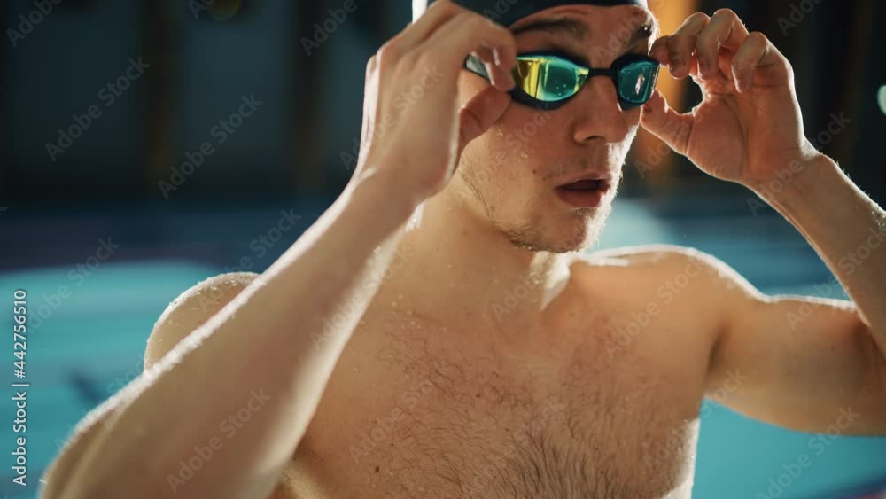 Handsome Professional Male Swimmer in Swimming Pool, Wearing Cap and ...
