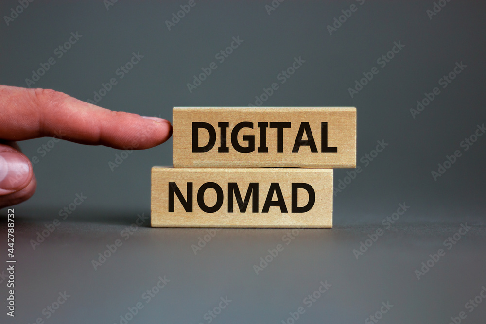 Digital nomad symbol. Wooden blocks with words Digital nomad on ...