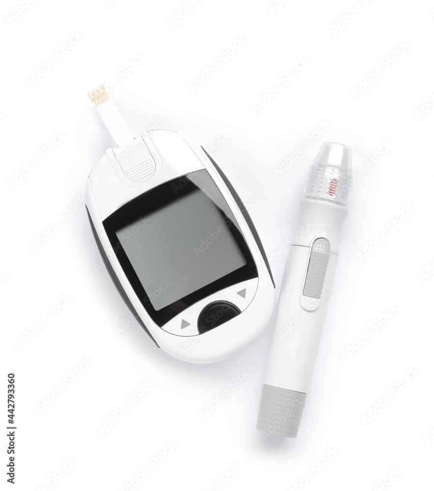 Modern glucometer with test strip and lancet pen on white background ...