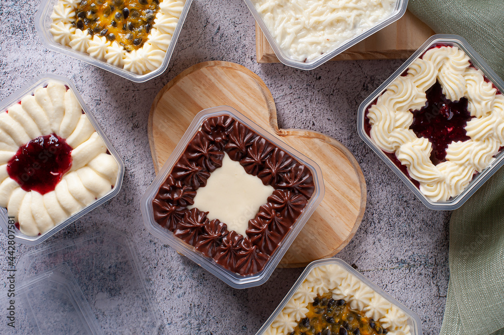 Variety of cake in the pot for delivery. Strawberry, passion fruit ...