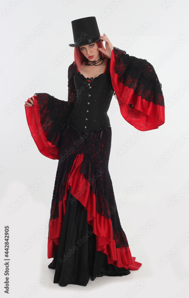 full length portrait of red haired woman wearing long black gothic ...