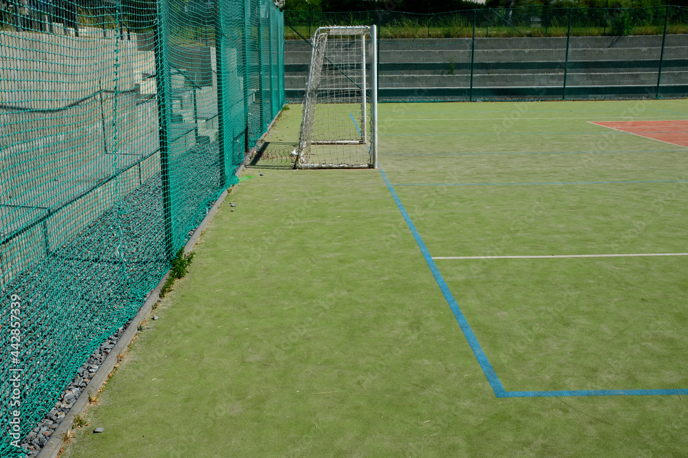 Outdoor playground for ball games. high barriers fencing protect ...