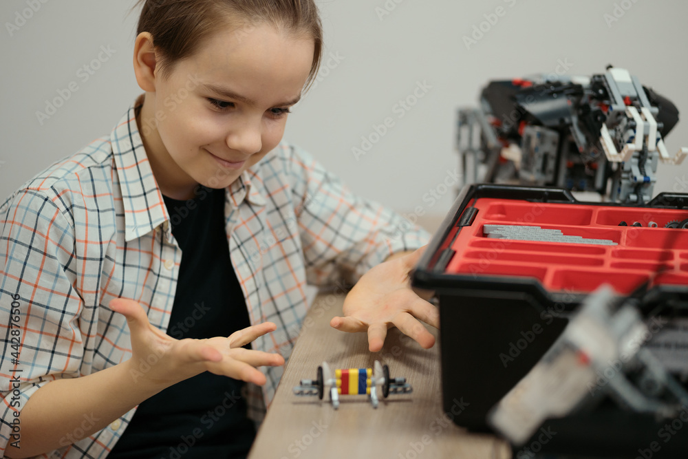 Boy Works on a Fully Functional Programable Robot for His School ...