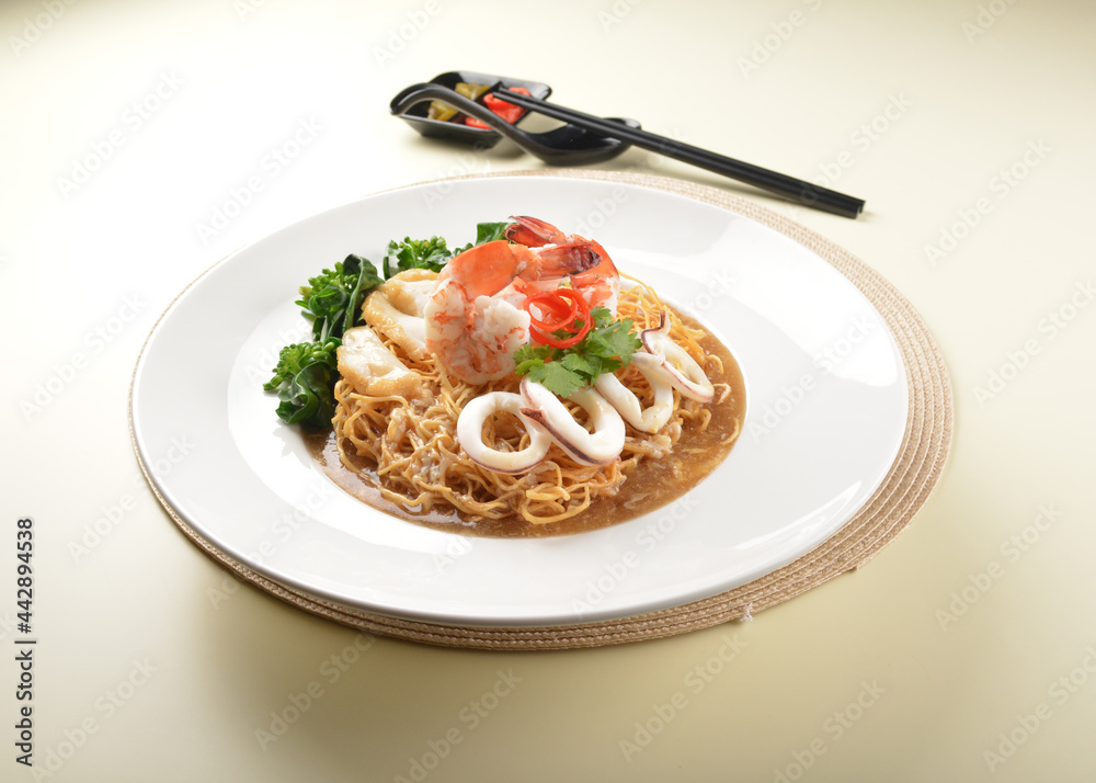 deep fried crispy yellow noodle mee with seafood big prawn and ...