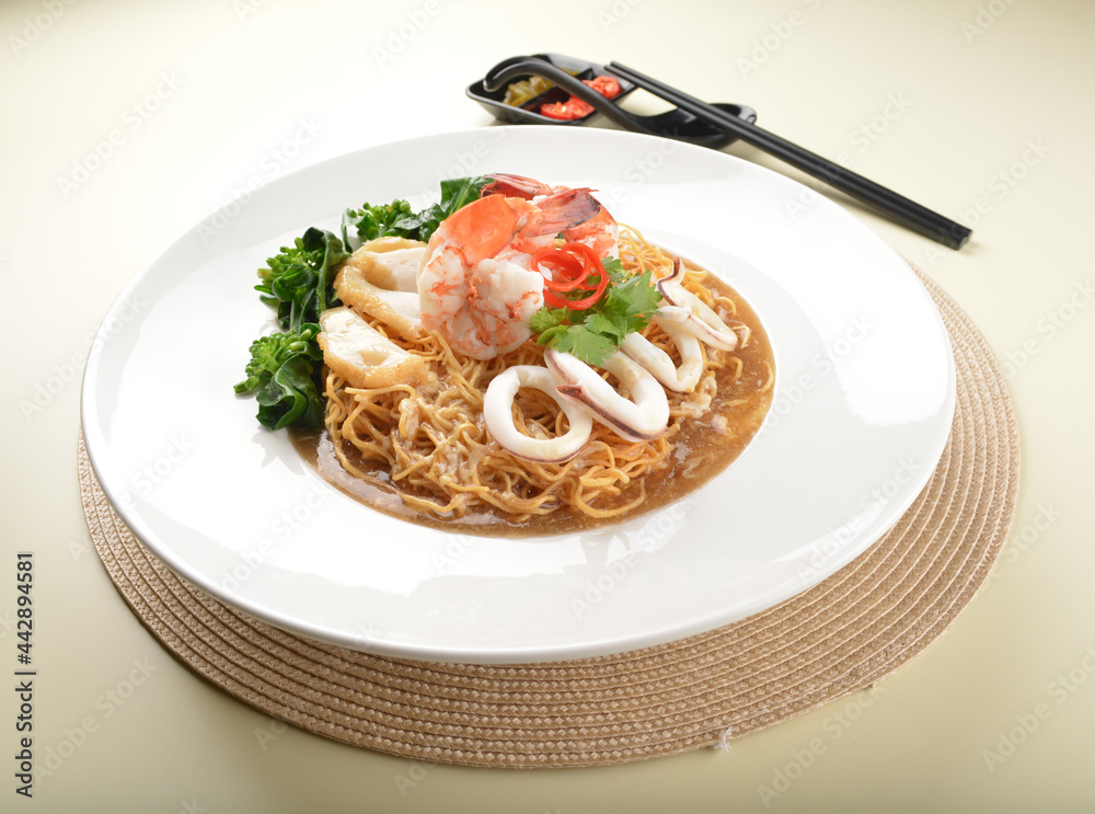 deep fried crispy yellow noodle mee with seafood big prawn and ...