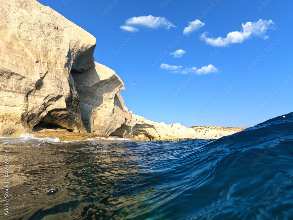 Underwater sea level split photo of iconic caves of Sarakiniko a ...