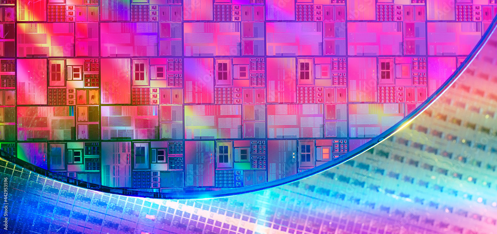 silicon wafer reflecting different colors. Stock Photo | Adobe Stock