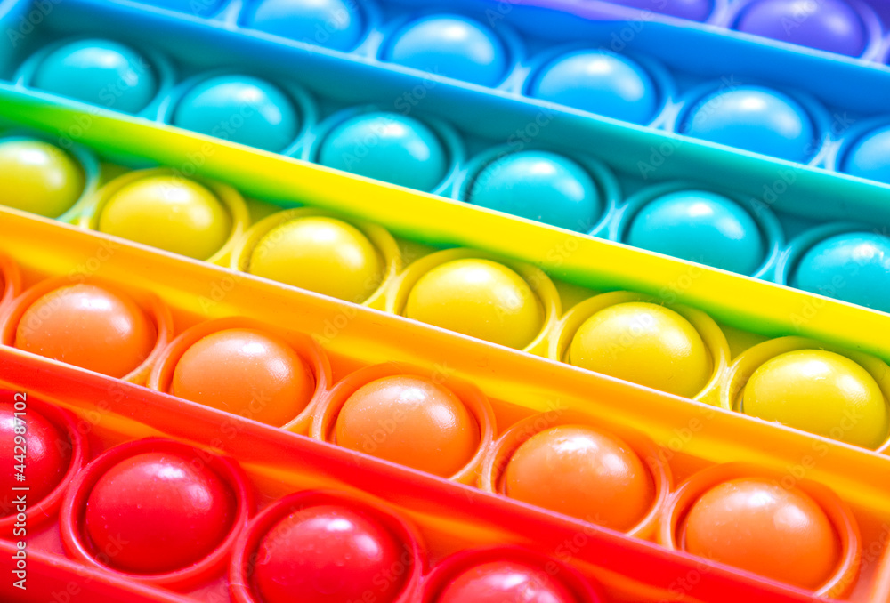 Pop it bubble fidget toy background Stock Photo | Adobe Stock