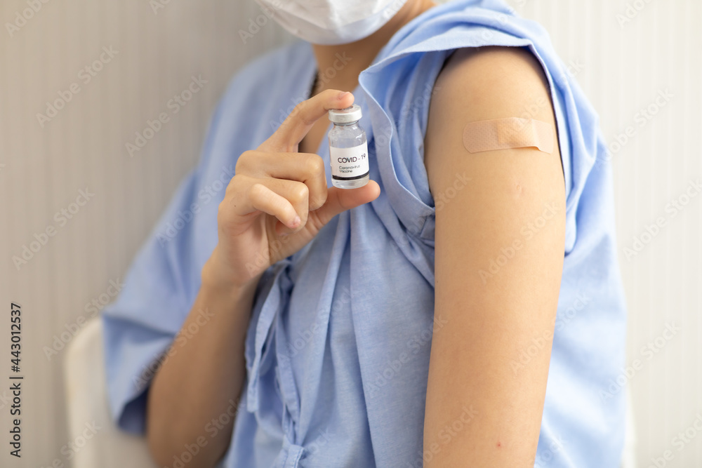Covid-19 Vaccination concept. portrait asian young woman showing arm ...