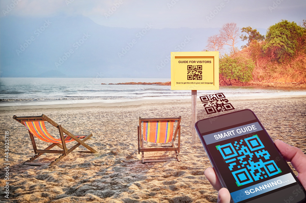 Hand holding smartphone with scanning QR code smart guide screen with ...