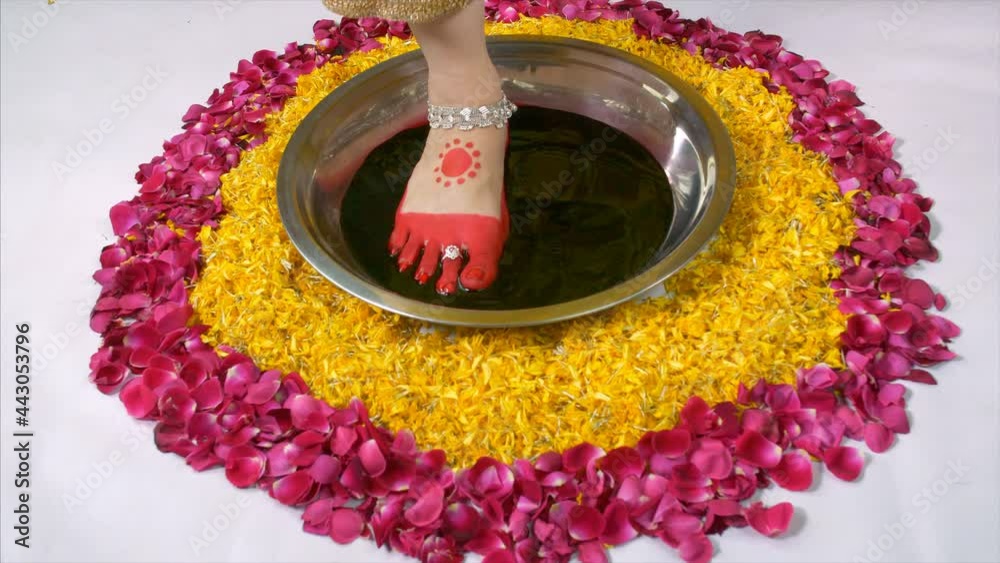 Closeup shot a beautiful Indian bride's performing Griha Pravesha ...