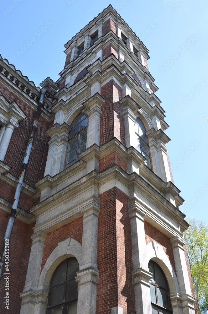 High wing of an old building. Manor house of a noble estate made of red ...