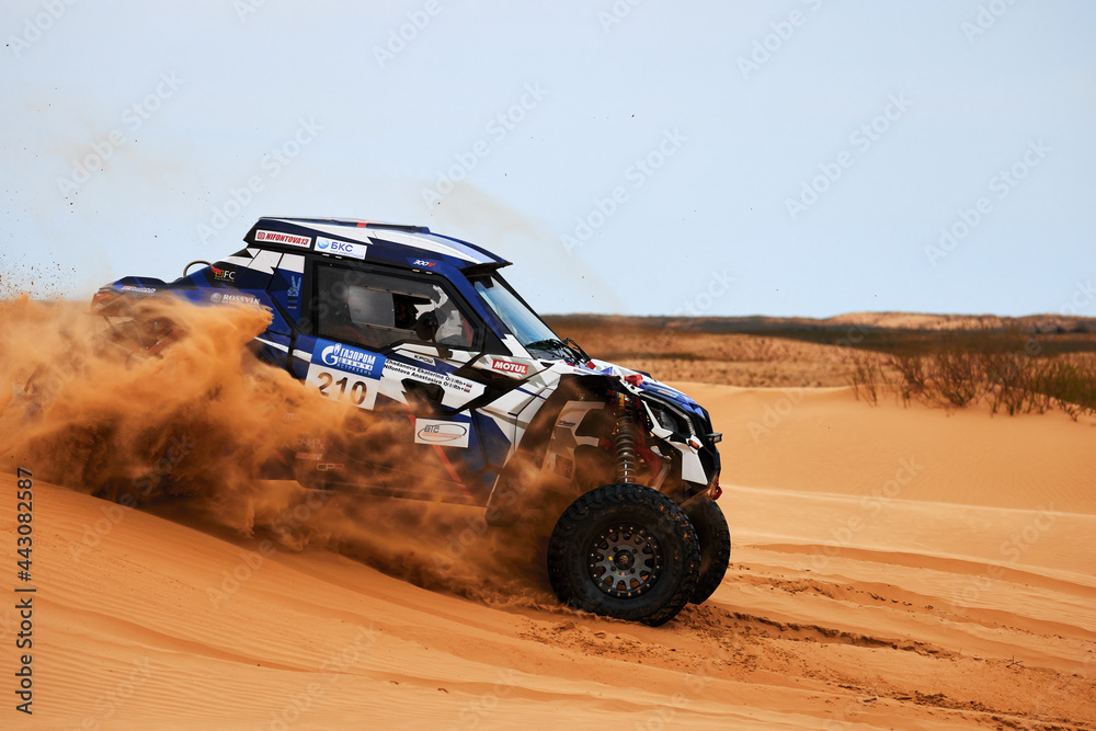 Women's crew at the rally. Sports car gets over the difficult part of ...