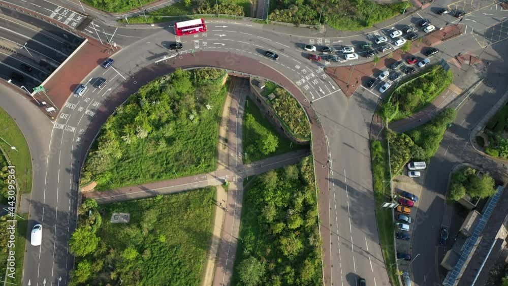 Static bird's eye view of traffic on multilane roundabout. Cars waiting ...
