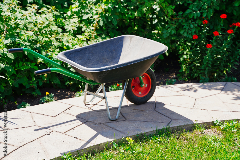 New plastic and Metal Garden Trolley in a botanical garden. Garden ...