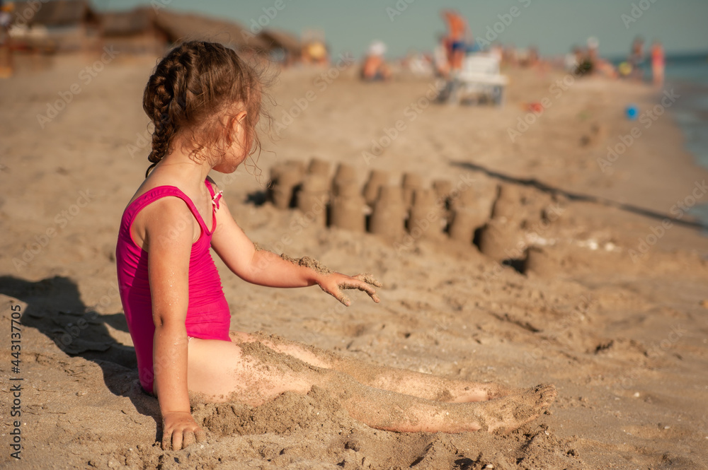 Cute Little Girl Playing In The Sand Stock Photo Adobe Stock