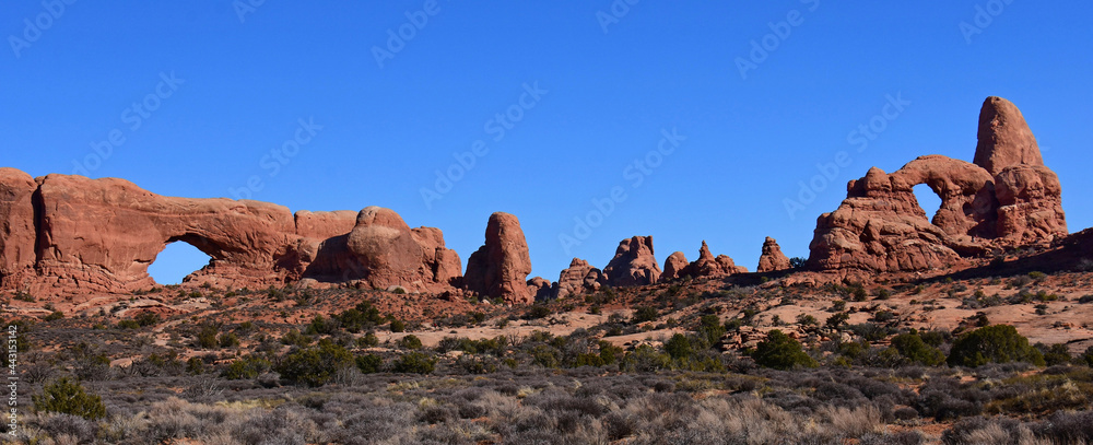 the eroded rock formations of north window arch turret arch in arches ...