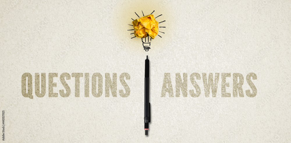 message QUESTIONS and ANSWERS with a pen and crumpled paper as a ...