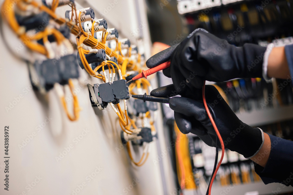 Electrician engineer work tester measuring voltage and current of power ...