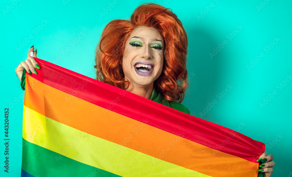 Happy drag queen celebrating gay pride holding rainbow flag symbol of ...