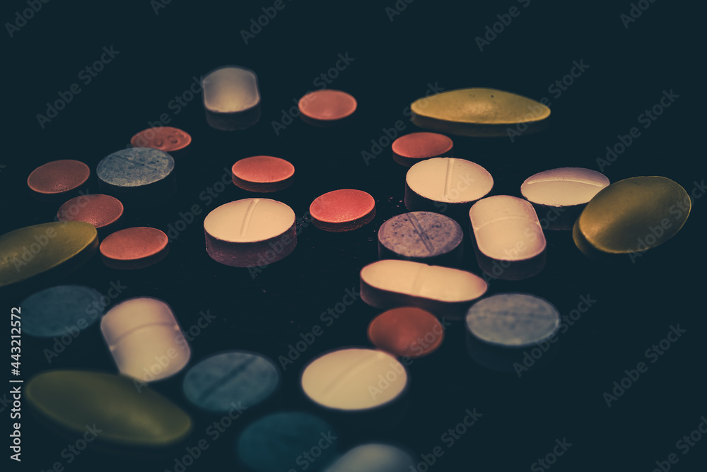 Pharmaceutical medicine pills in both tablets and capsules with the ...