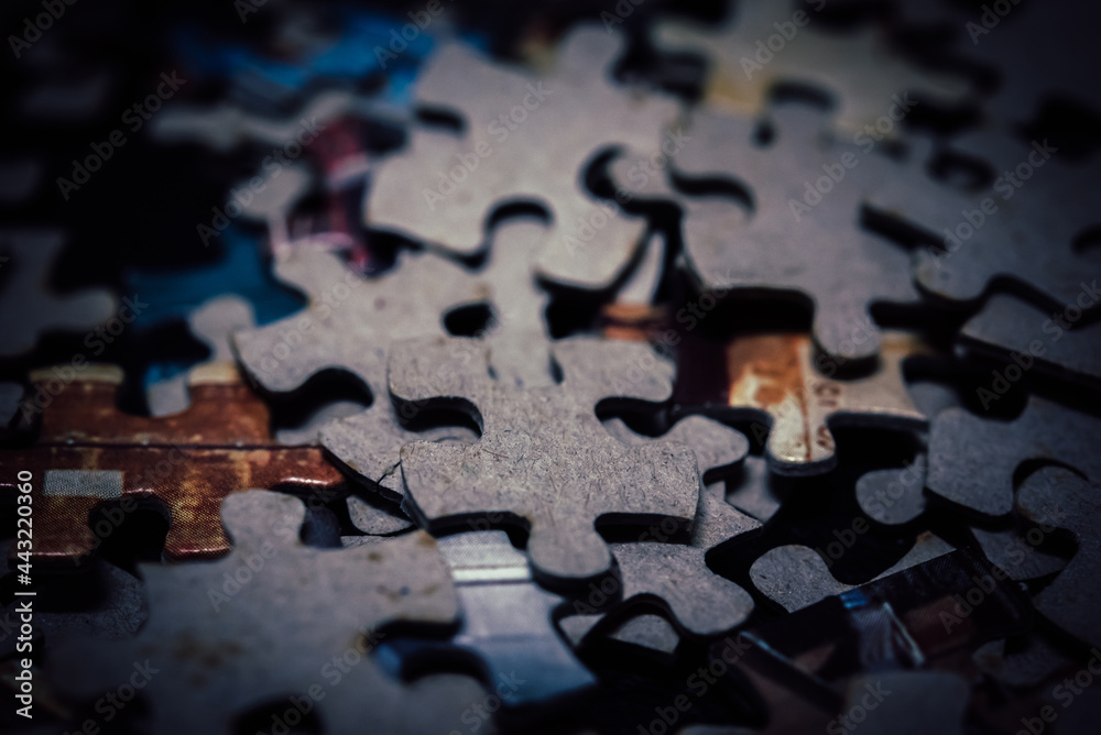 jigsaw puzzle on wooden background. to represent how complexity in game ...