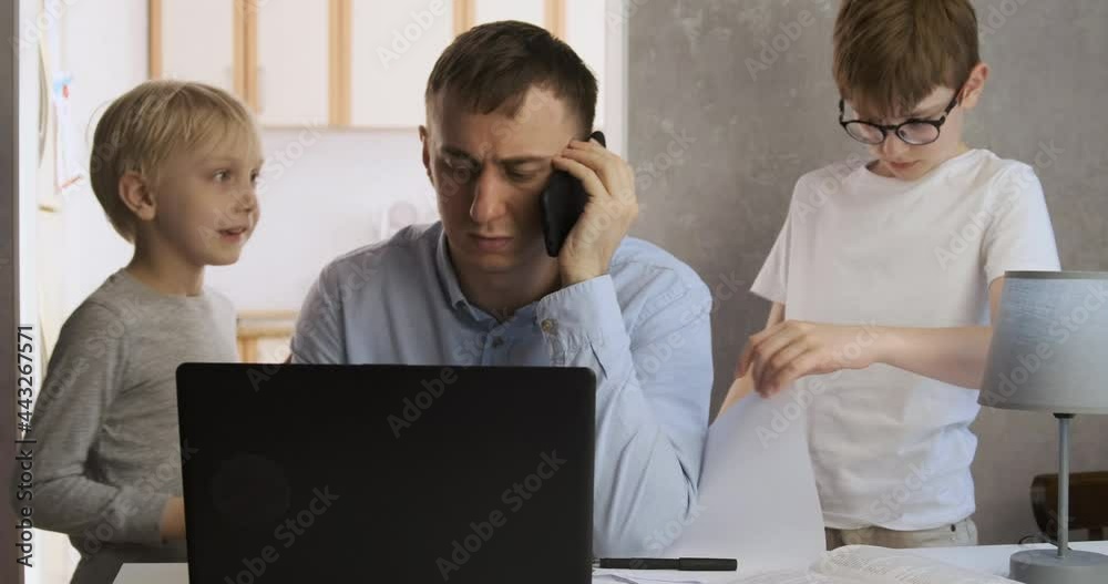 Father tries to work remotely with his children at home. Sons interfere ...