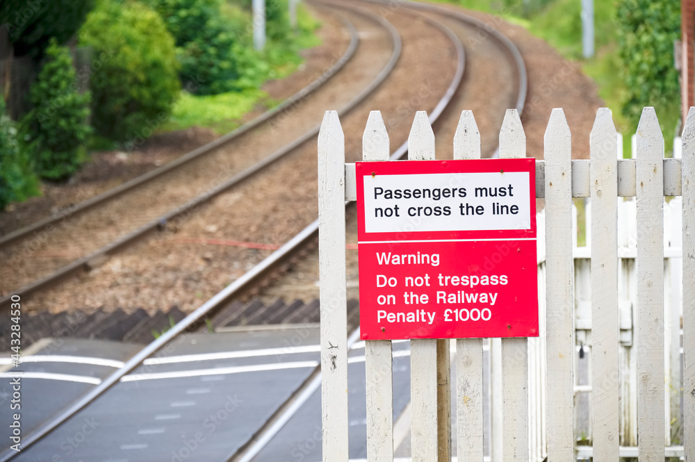 Stop look listen safety road sign at railway train station danger ...