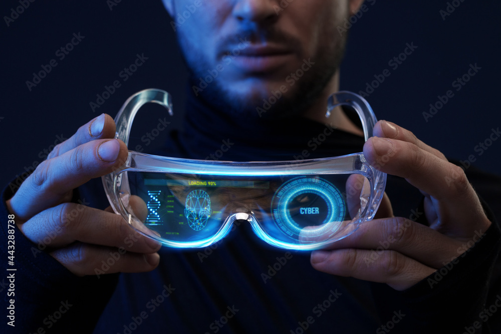 Man with futuristic tablet in hand. Guy using VR glasses. Augmented ...