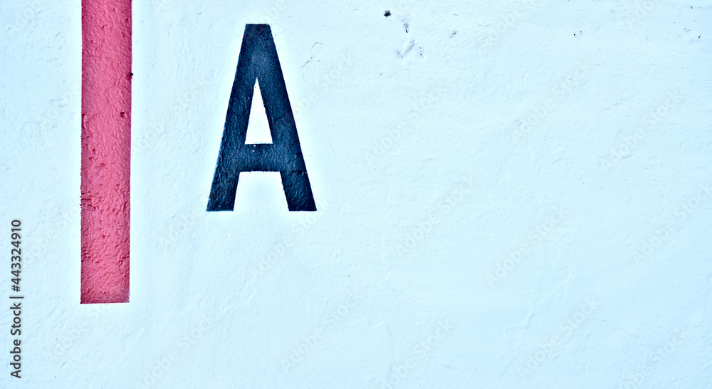 Capital letter A and a short vertical red line on a white background ...