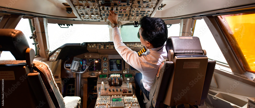 Airline pilot work in the cockpit Stock Photo | Adobe Stock