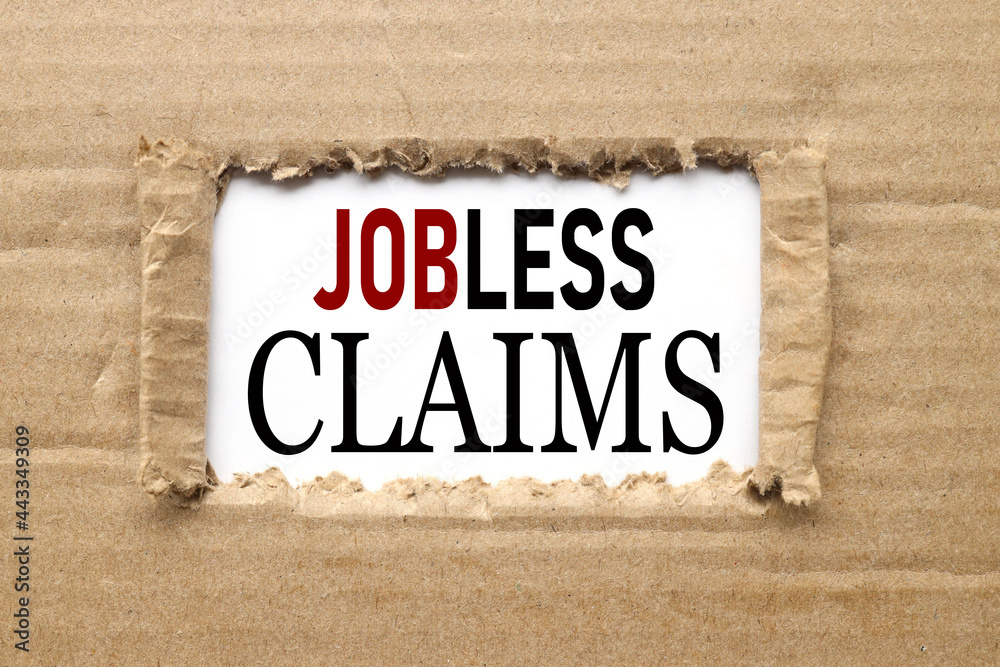 JOBLESS CLAIMS. text on torn paper. test in black letters Stock Photo ...