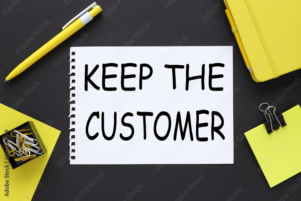Keep The Customer. text on a black background, on white paper, next to ...