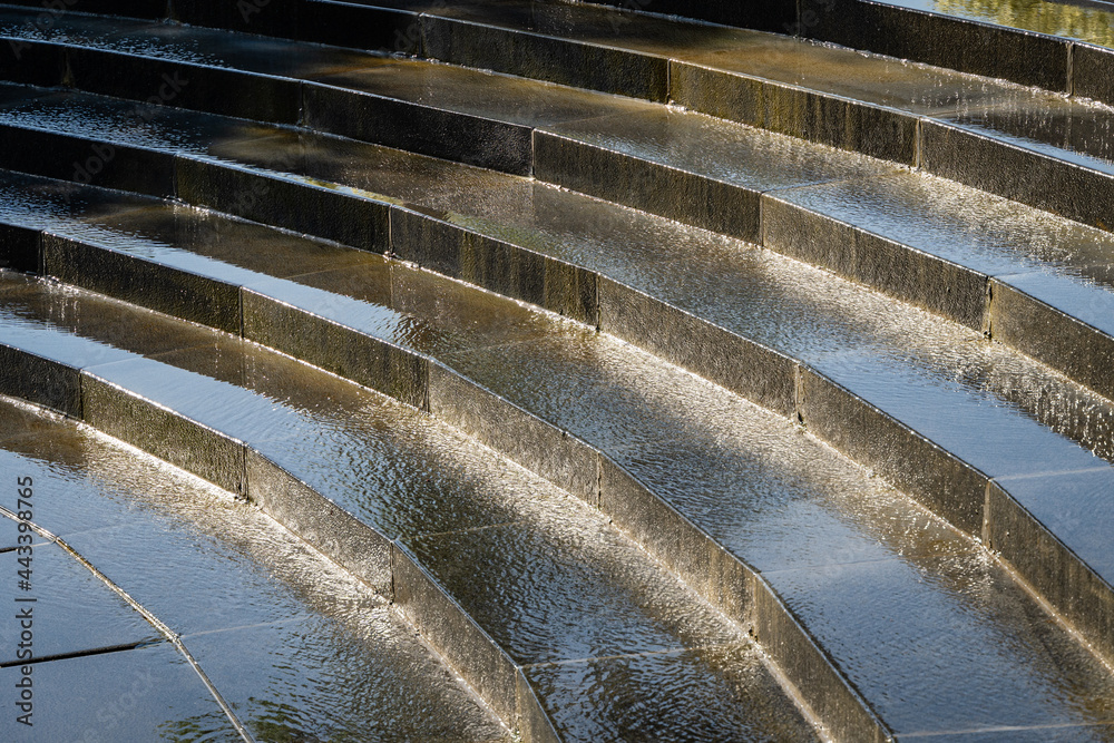 Water from Fountain of "Infinity" bowl flows down granite steps to ...