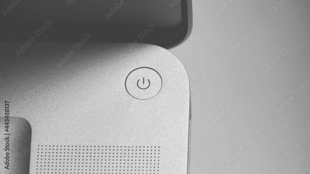 Power button of a laptop computer close up background with copy space ...