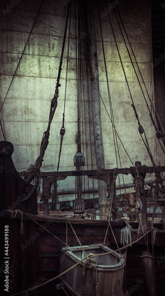 Old pirate ship with sail and mast as gloomy vintage retro background ...