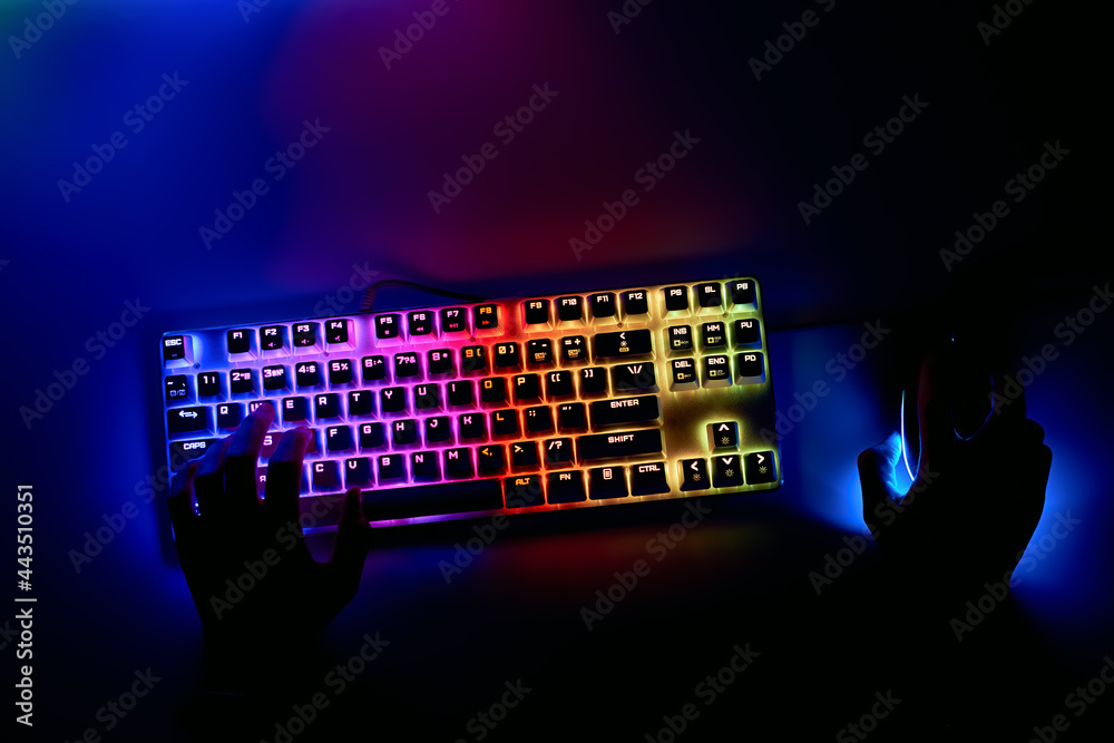 Gamer is playing a computer game, top view. A man is playing a video ...