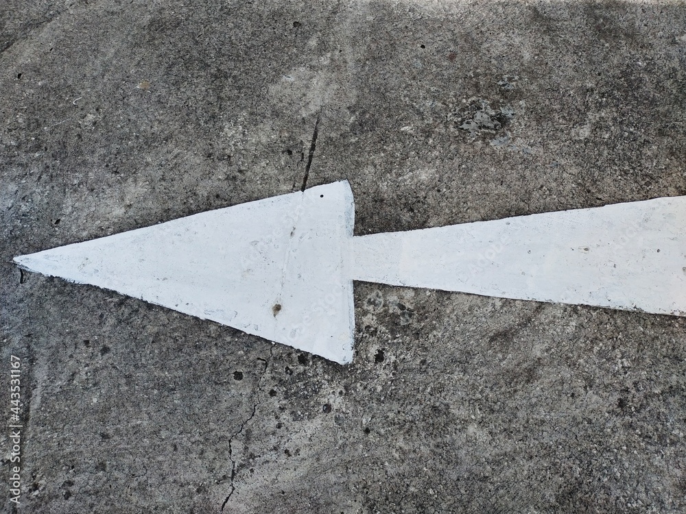 Concrete roads are marked with arrows indicating the direction of the ...