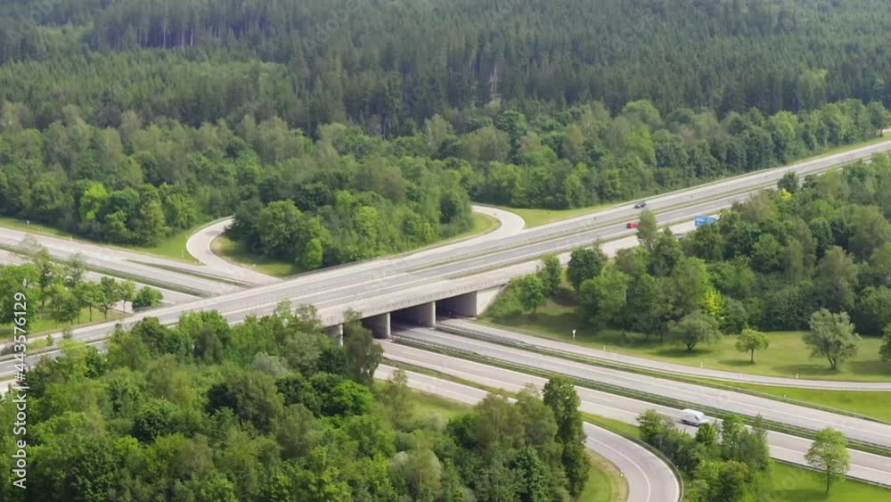 Timelapse of fast driving cars at a german highway with curved exit ...