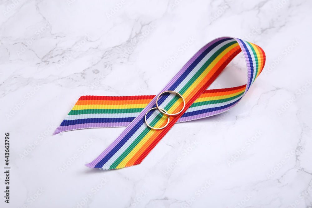 LGBT rainbow ribbon pride tape symbol on marble background. Stock Photo ...