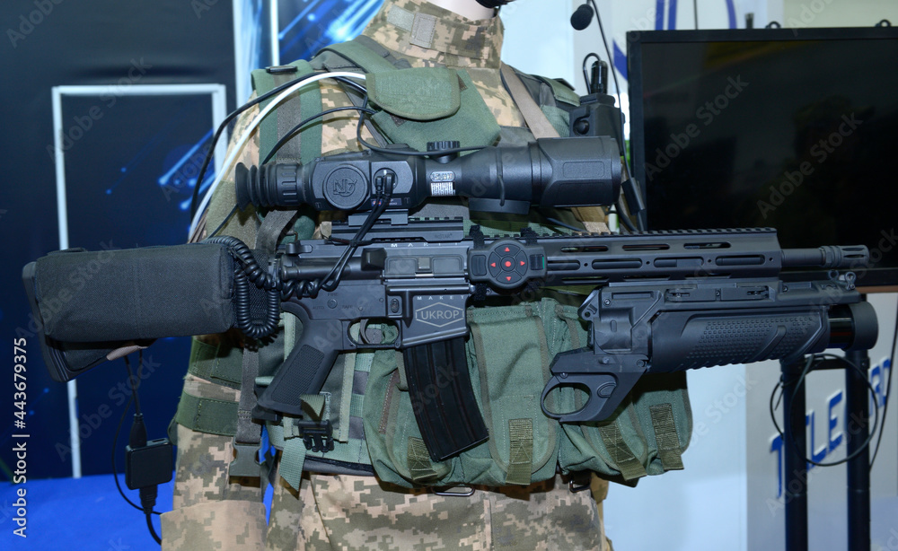 Modern machine gun with an underbarrel grenade launcher presented on ...
