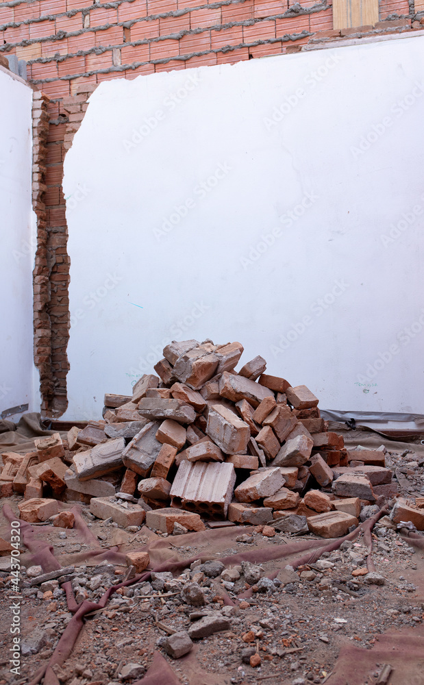 Construction. demolition process. Mud brick rubble pile, with an open ...