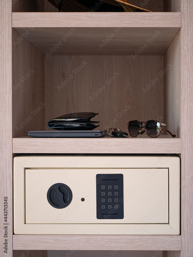 Modern safe box in cabinet, Security Safe Box in hotel room with ...